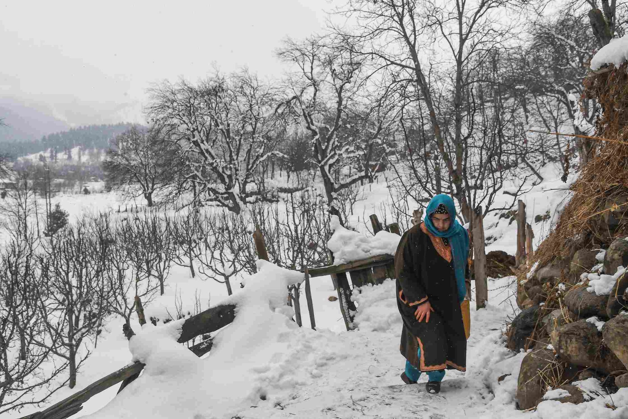This 55-YO Kashmiri Postwoman Walks Miles Through Snow to Deliver Mail